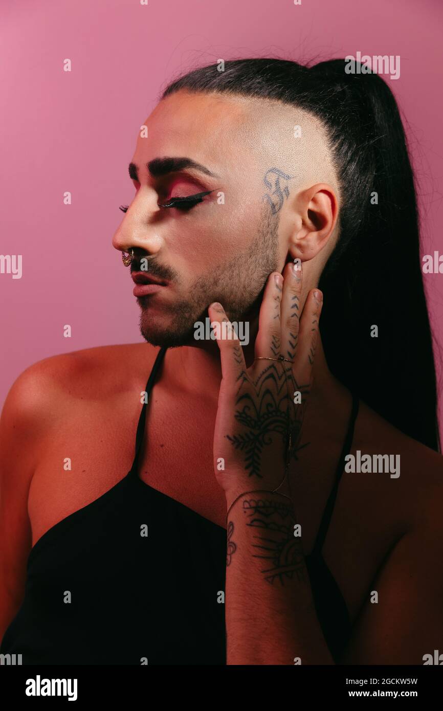 Side view portrait of glamorous transgender bearded Woman in ...