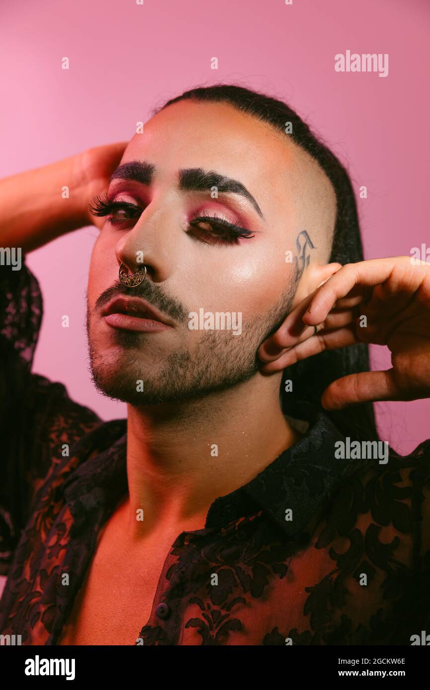 Portrait of glamorous transgender bearded Woman in sophisticated make ...