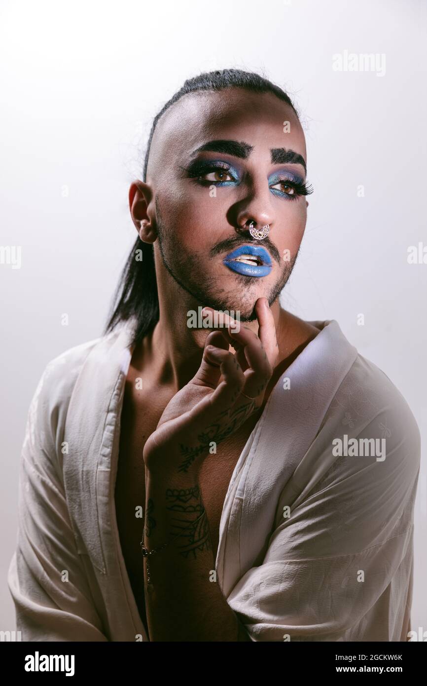 Portrait of glamorous transgender bearded Woman in sophisticated make ...