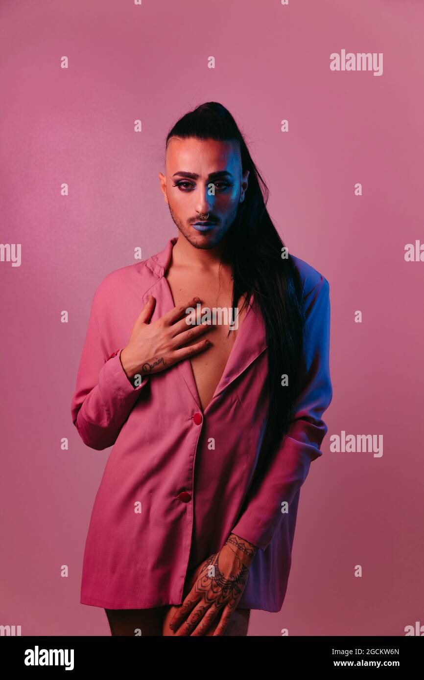 Portrait of glamorous transgender bearded Woman in sophisticated make ...