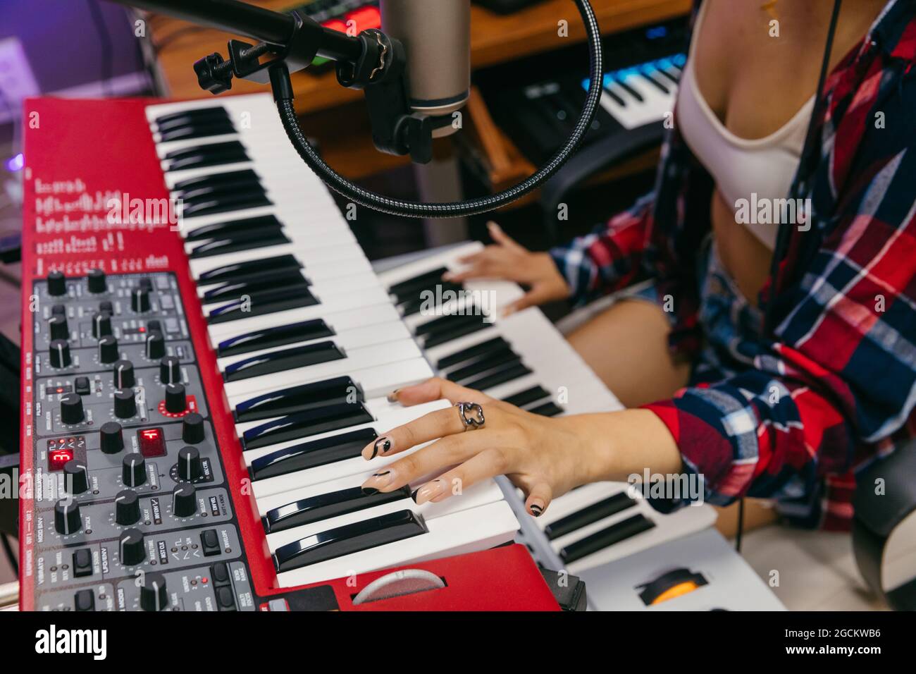 Cropped unrecognizable African American female singer in headset ...