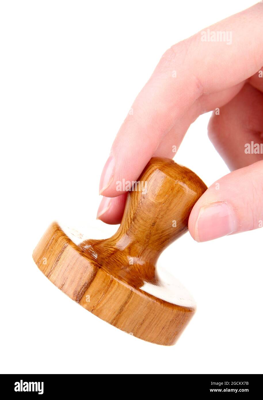 Hand with wooden stamp, isolated on white Stock Photo - Alamy