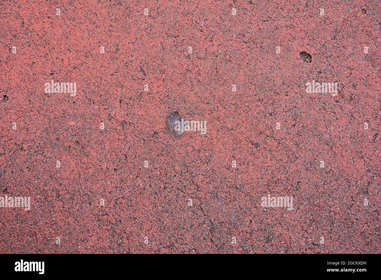Closeup of a red surface with dots on it Stock Photo - Alamy