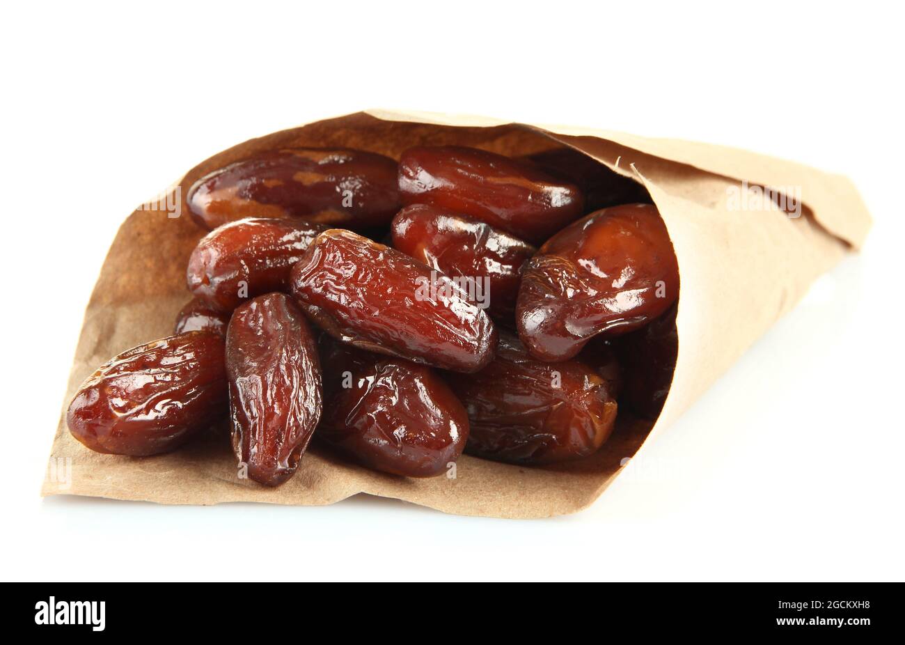 Dried dates in paper cone isolated on white Stock Photo - Alamy