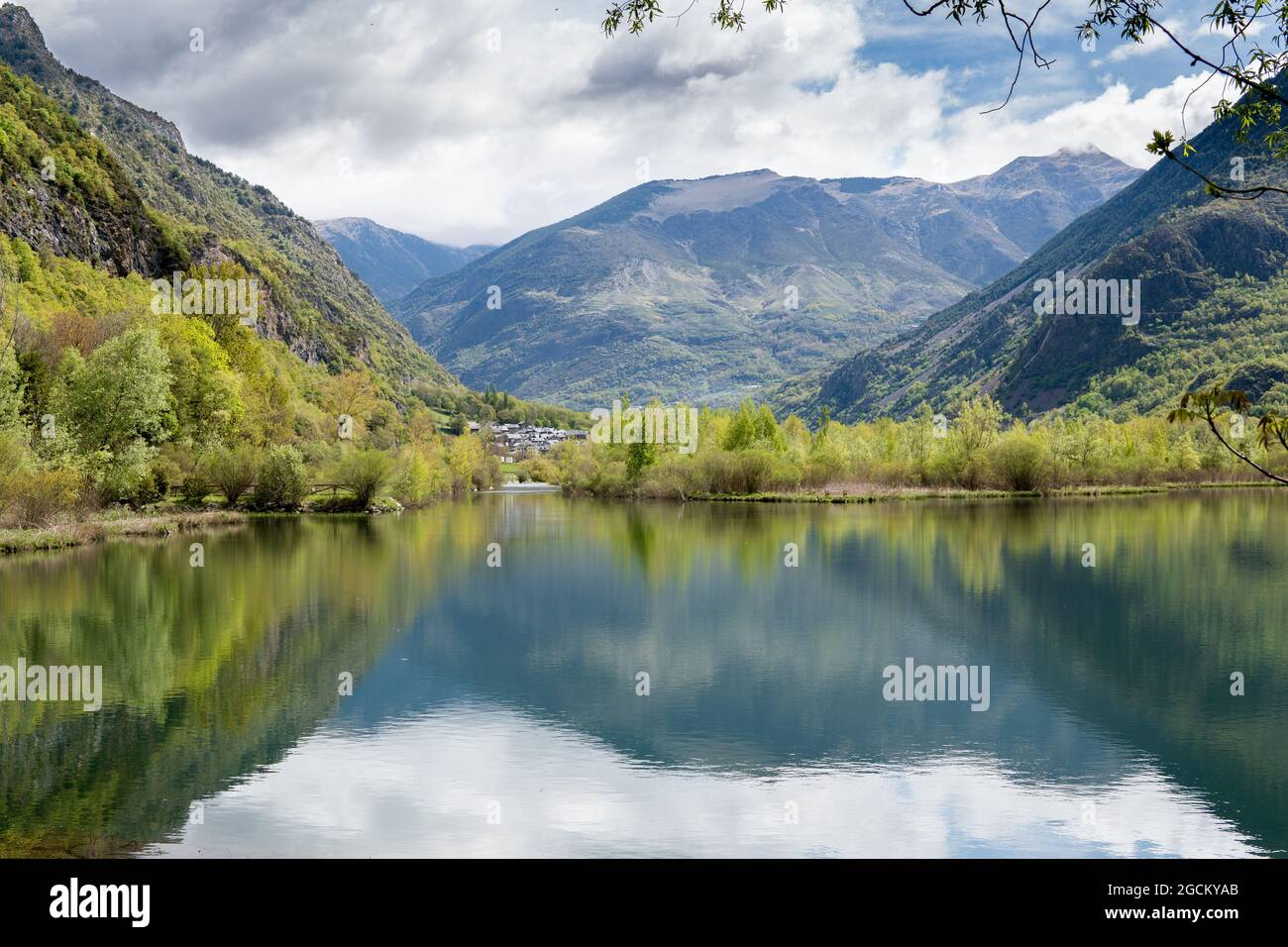 Spectacular scenery of calm pond located in rocky highlands in Pyrenees ...