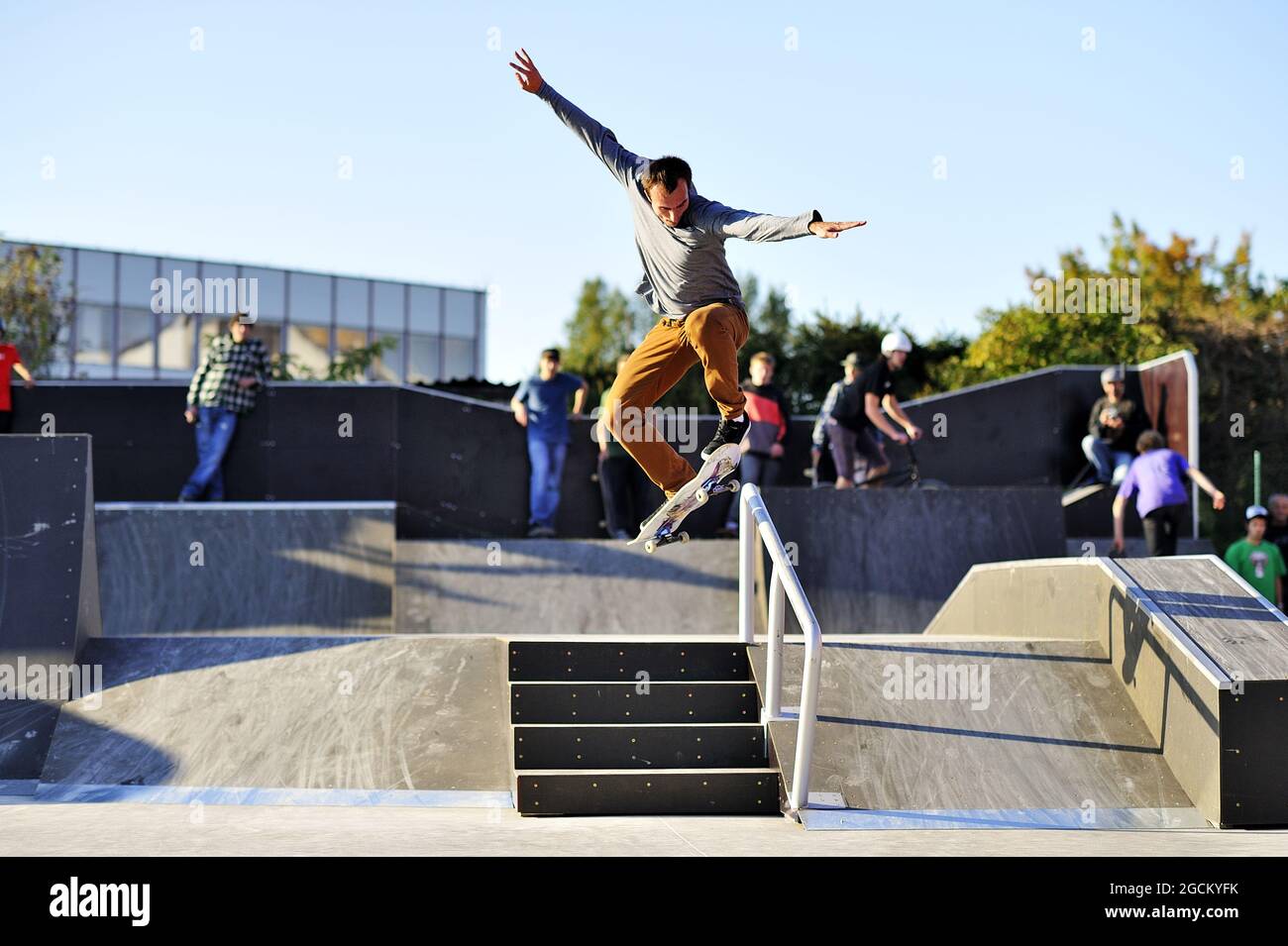 Boy high jumps on a skateboard on the railing Stock Photo - Alamy