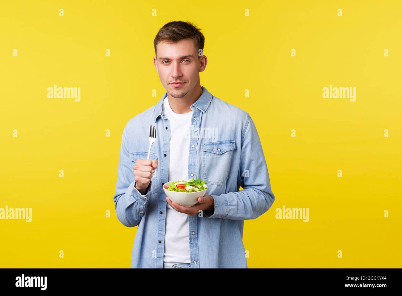 Healthy lifestyle, people and food concept. Sassy good-looking blond ...