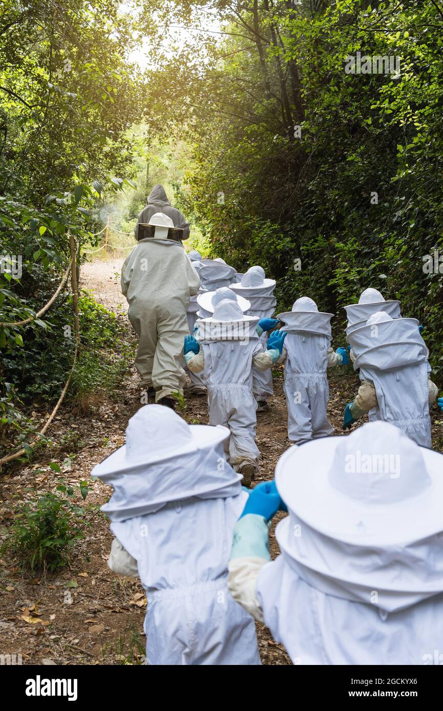 Back view of group of unrecognizable children in protective costumes ...