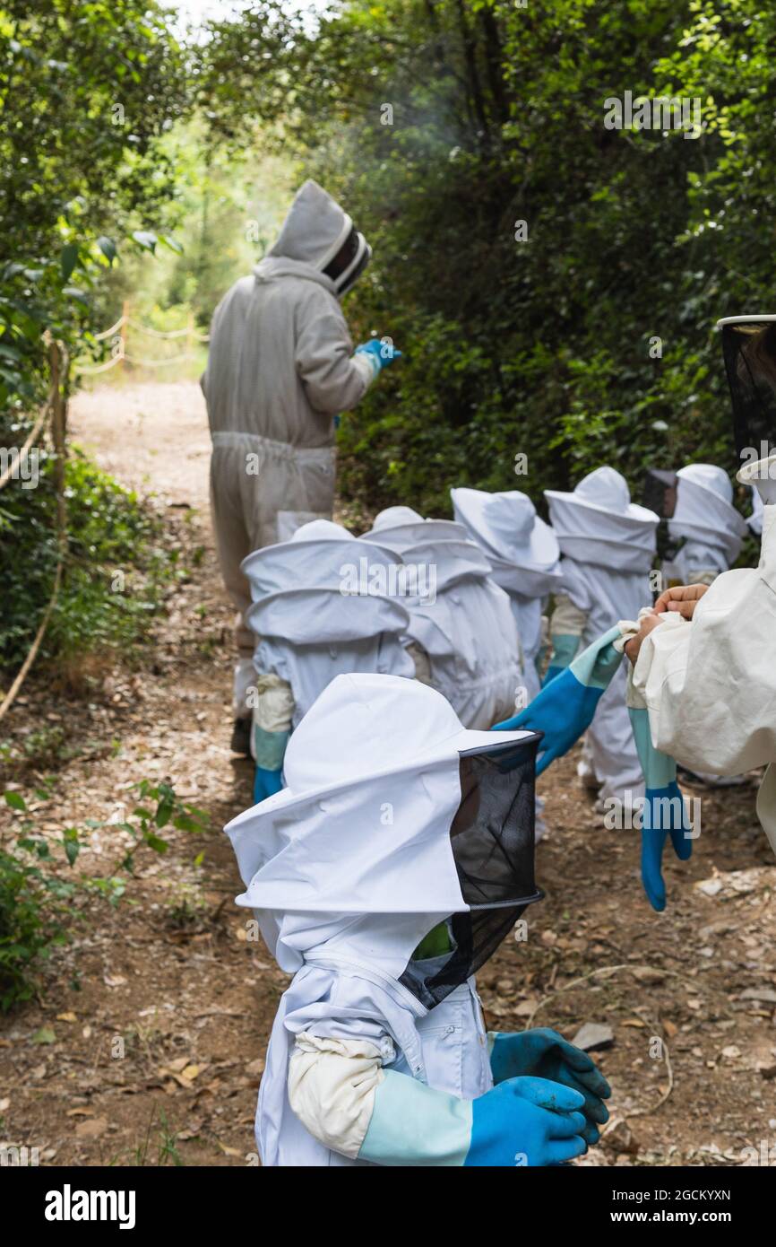Back view of group of unrecognizable children in protective costumes ...