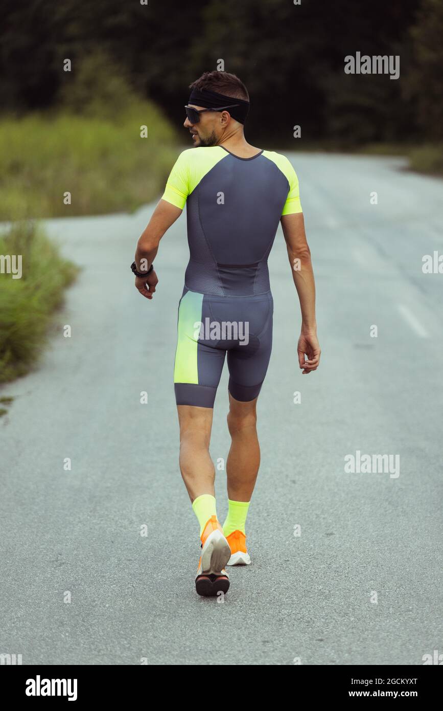 Slim young man walking street hi-res stock photography and images - Alamy
