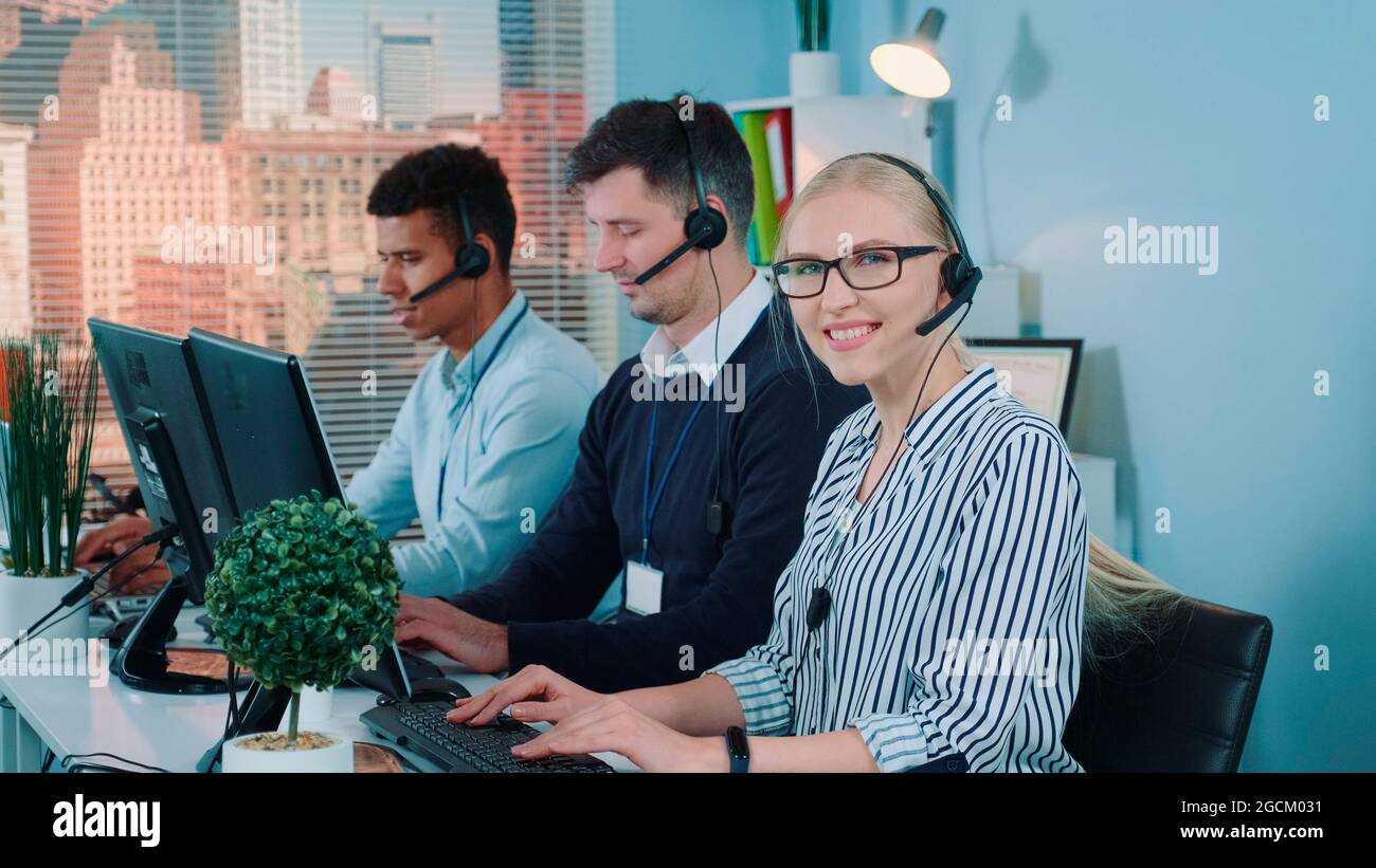 Beautiful female customer service working in busy call center by ...