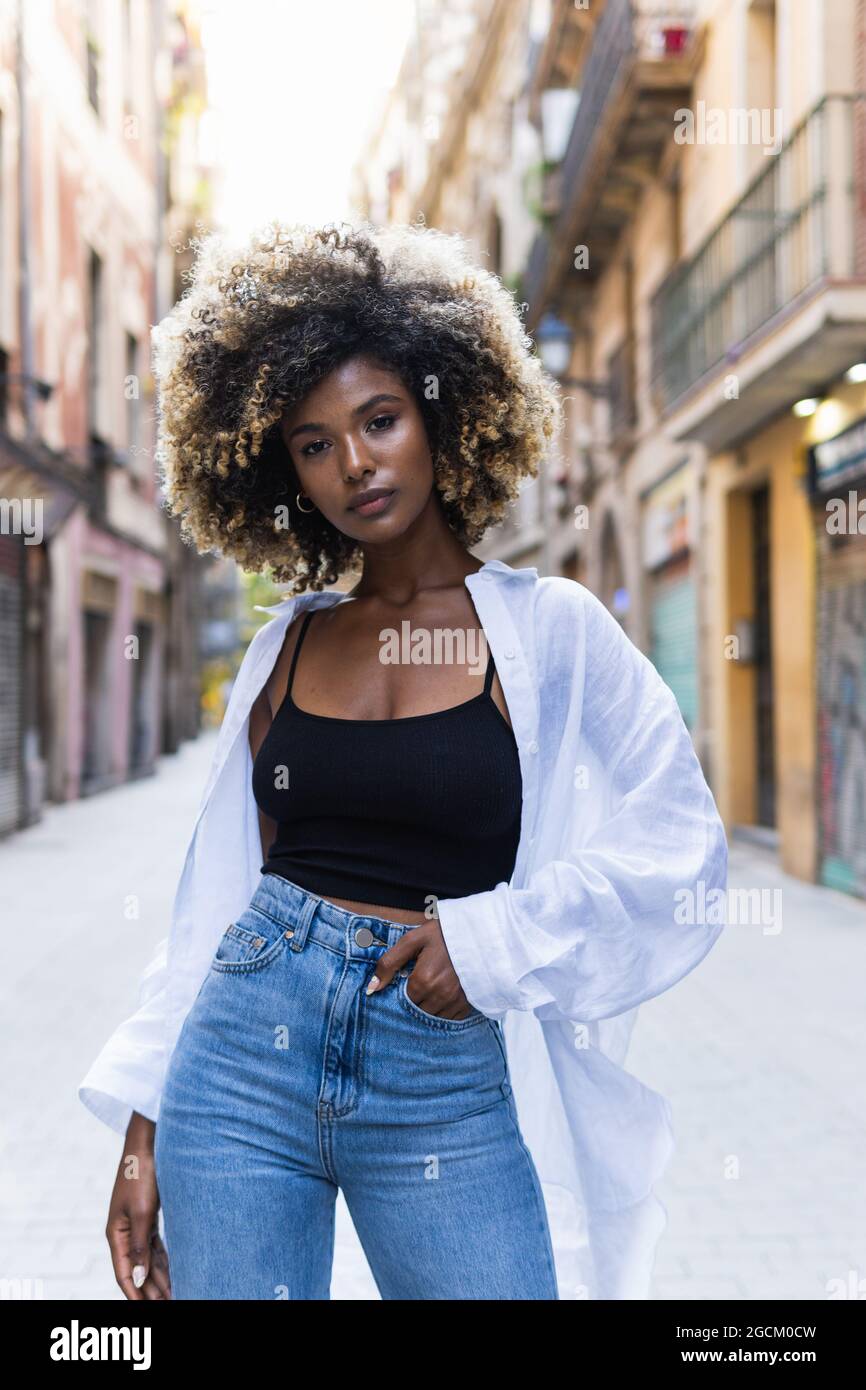 Anonymous female in modern headset with outstretched arms exploring ...