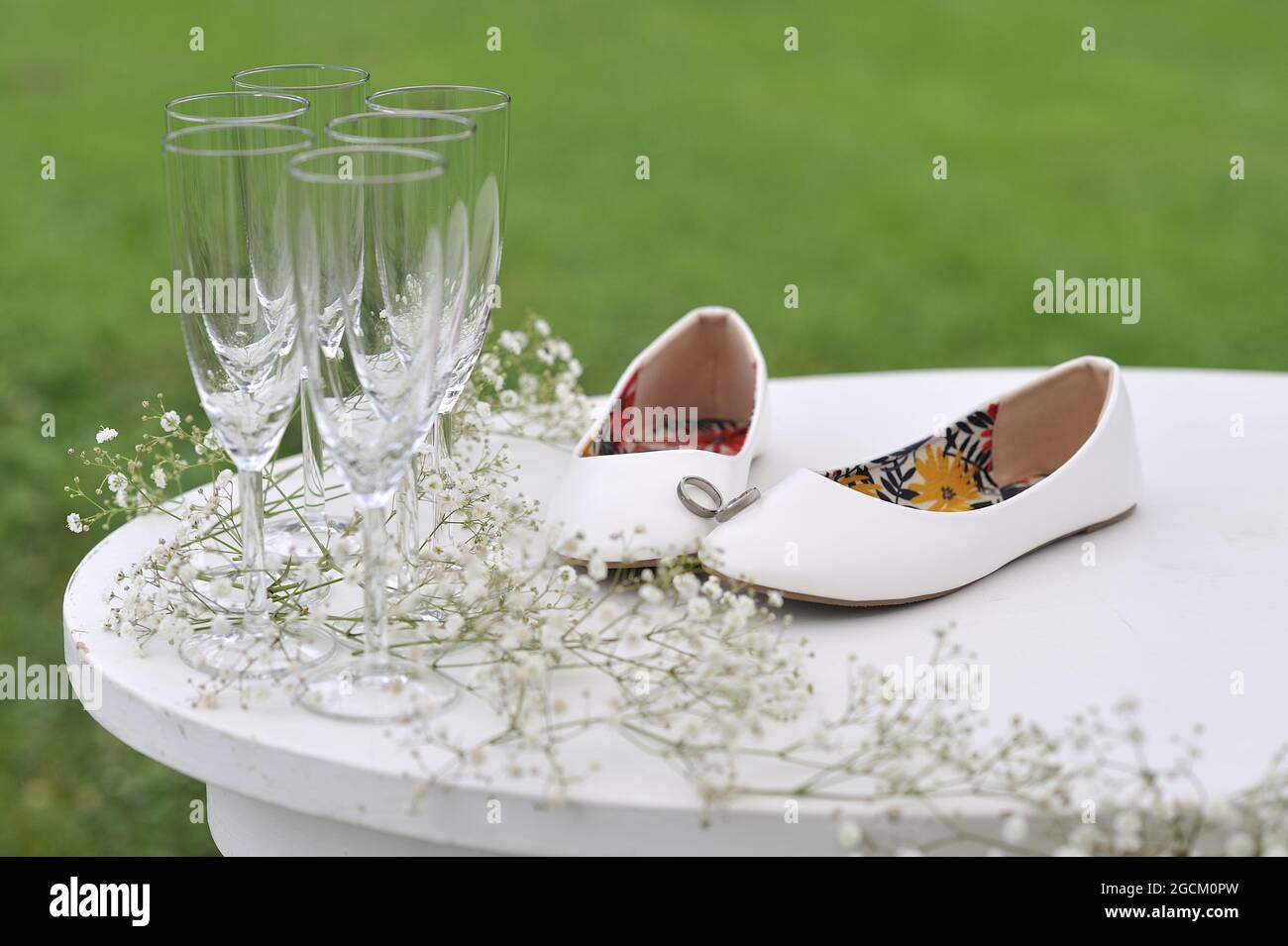 Wedding wooden table with shoes Stock Photo - Alamy
