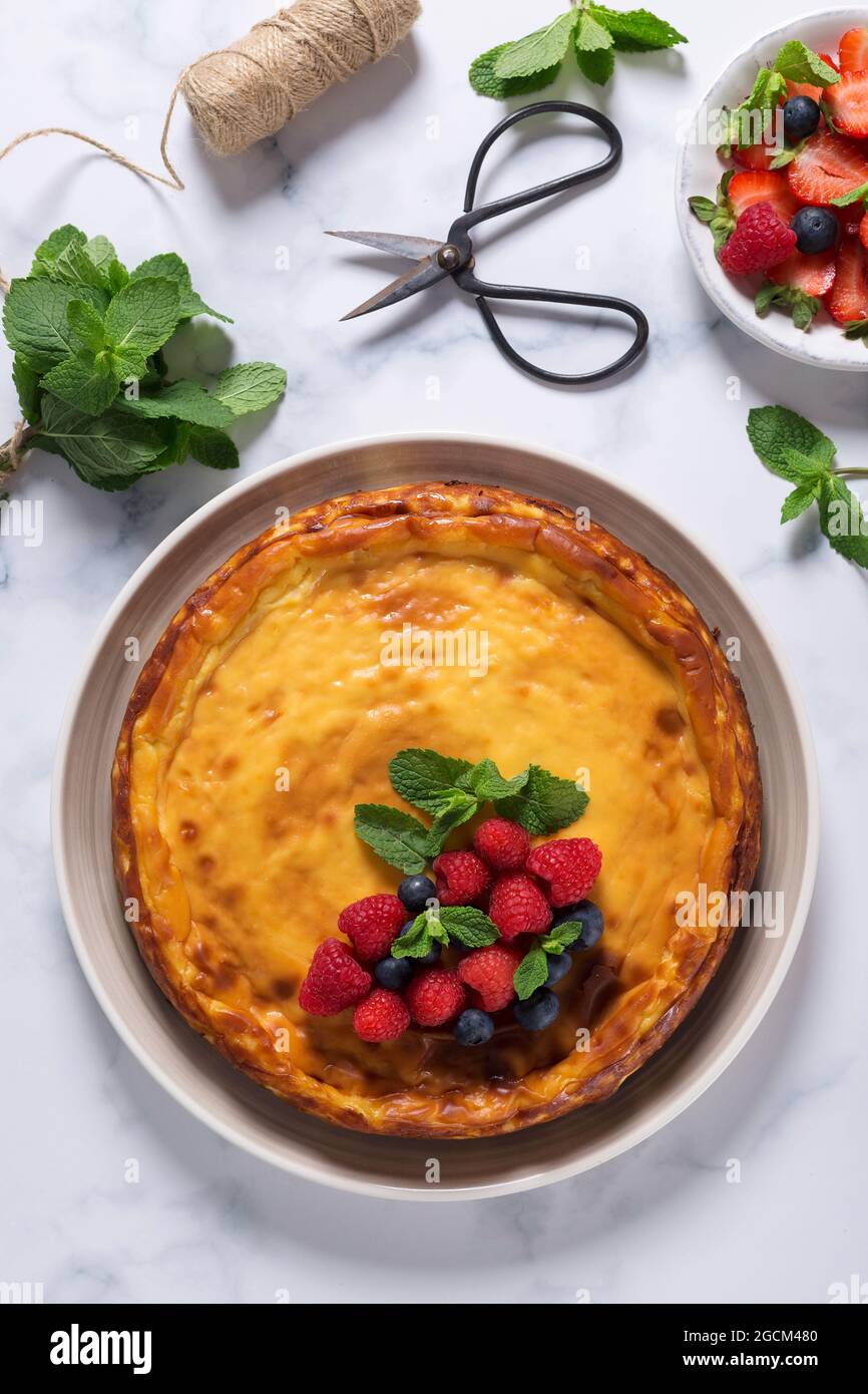 From above view of cheesecake decorated with raspberries, blueberries ...
