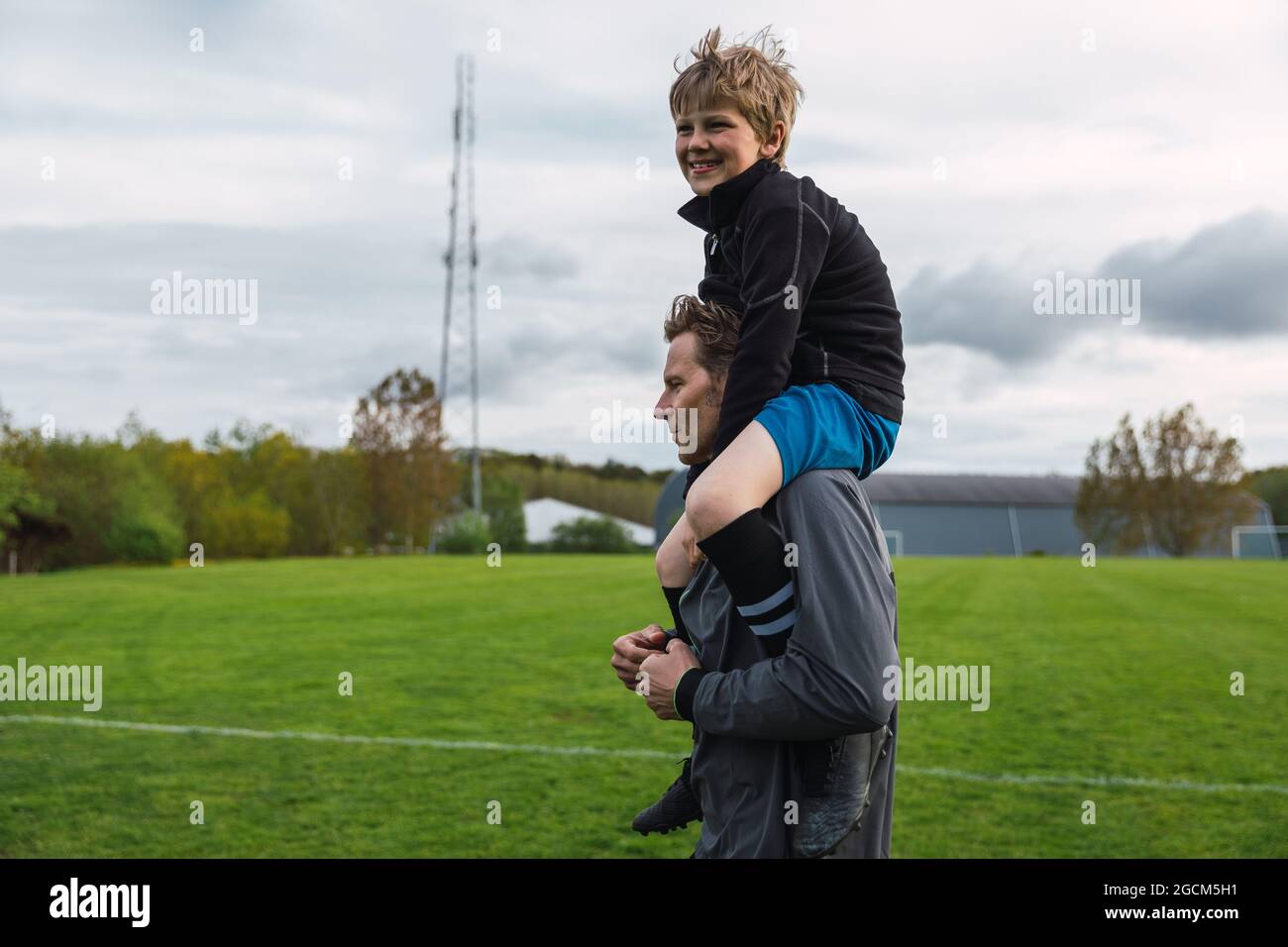 Football boy carrying hi-res stock photography and images - Alamy