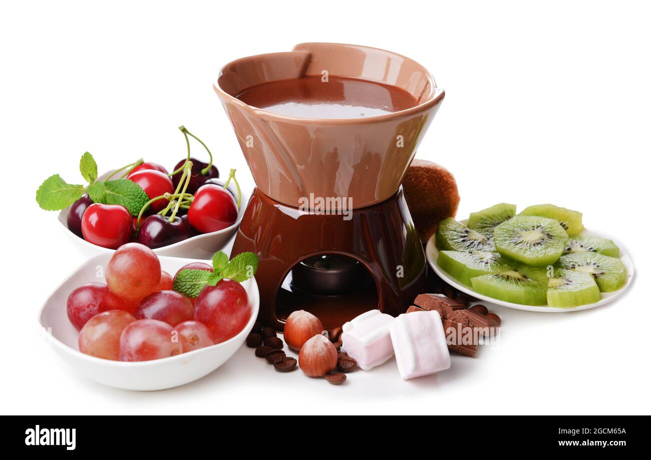 Chocolate fondue with sliced fruits, isolated on white Stock Photo - Alamy