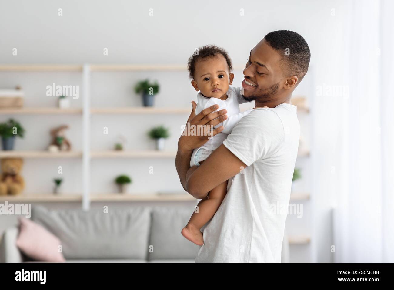 Father And Baby. Portrait Of Happy Black Dad Holding Adorable Infant ...