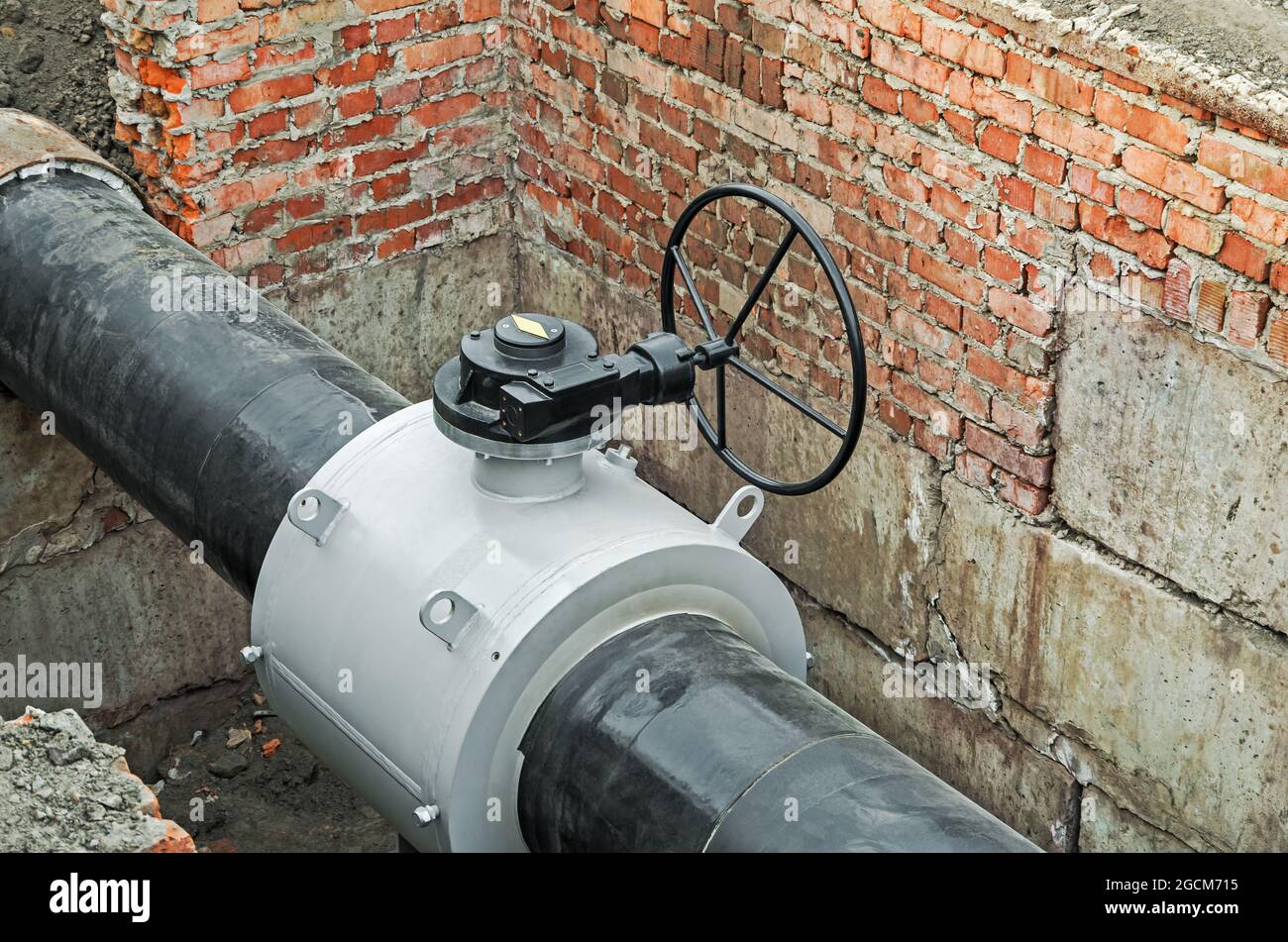 Large modern metallic valve on plastic main water pipe which was put in ...