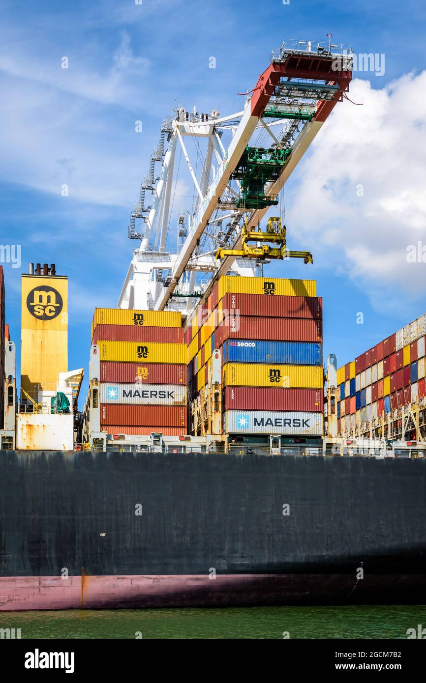 A super post-panamax container gantry crane unloading containers from ...