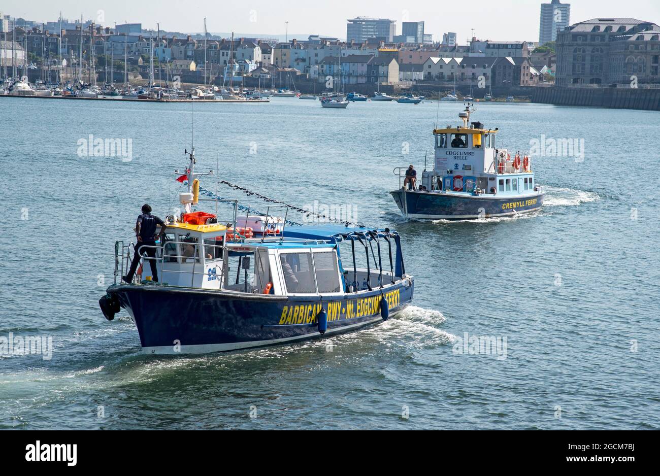 Cremyll, Cornwall, England, UK. 2021. Two passenger ferries arriving at ...