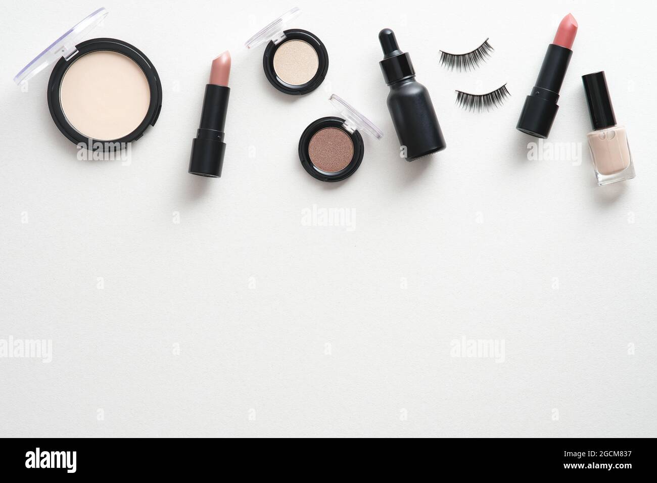 Frame of makeup cosmetics on white background. Flat lay, top view. Face ...