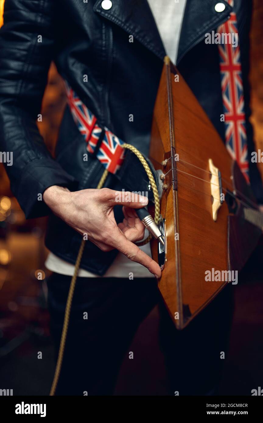 Musician connects the balalaika, music performing Stock Photo - Alamy