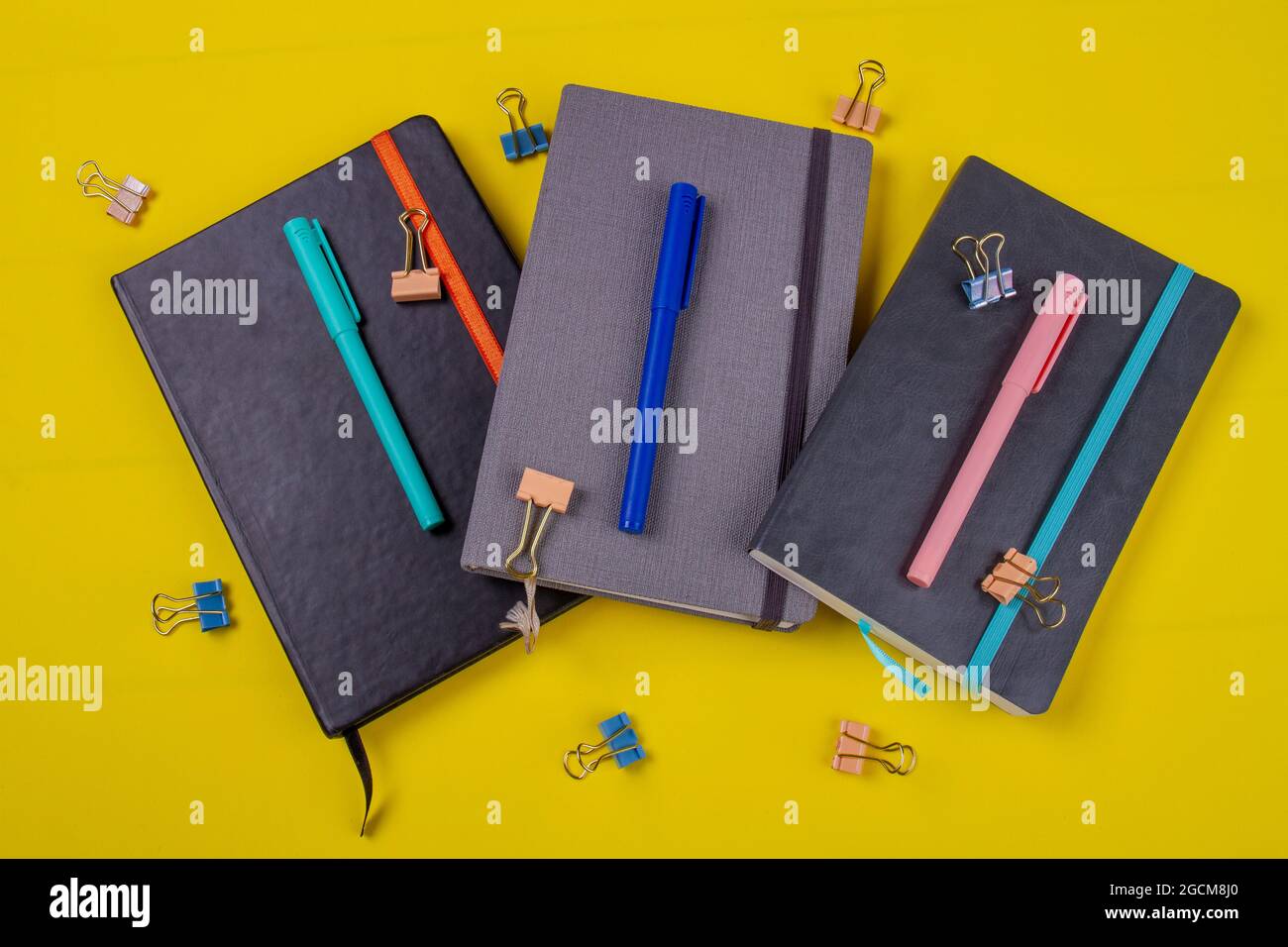 Books with felt pens and paper clips Stock Photo - Alamy