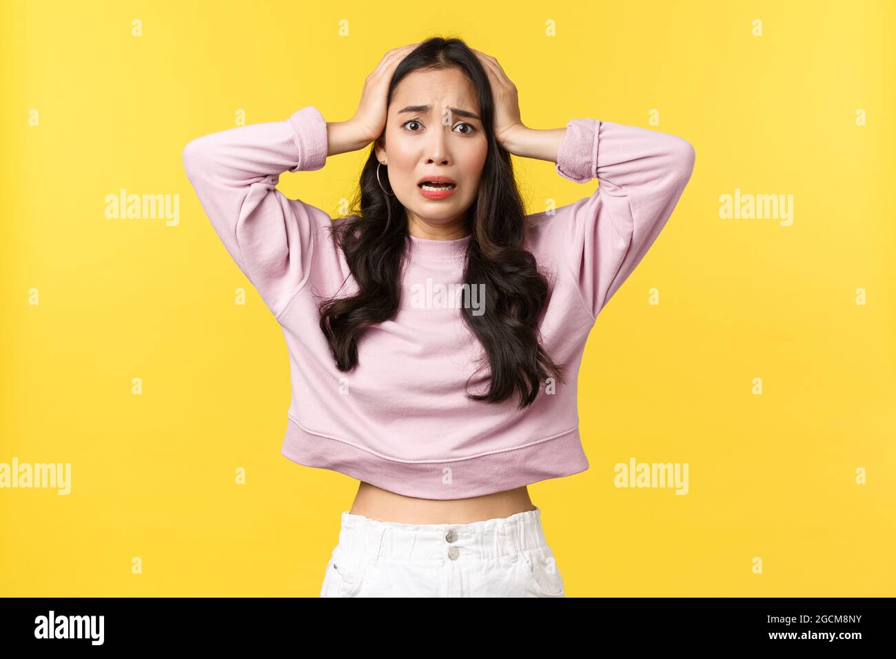 Lifestyle, emotions and advertisement concept. Anxious asian woman in ...