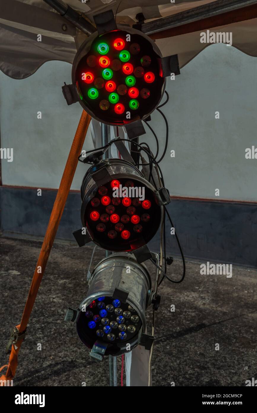 Concert color lights on stage under white new roof Stock Photo - Alamy
