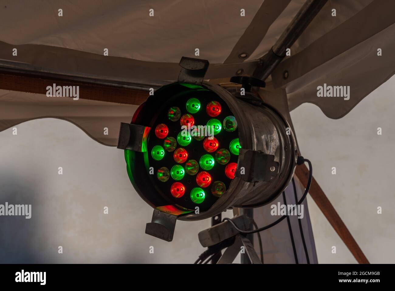 Concert color lights on stage under white new roof Stock Photo - Alamy