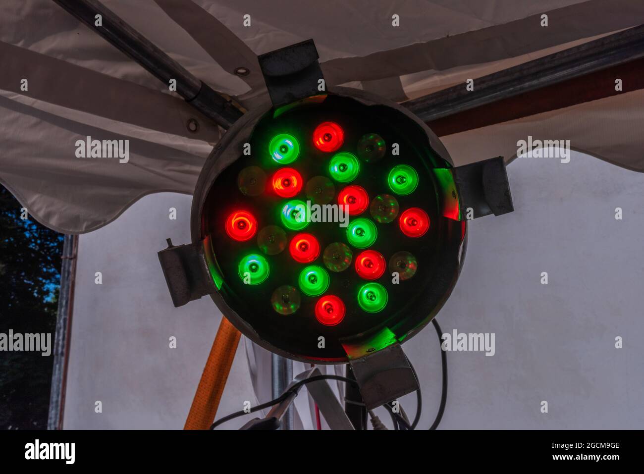 Concert color lights on stage under white new roof Stock Photo - Alamy