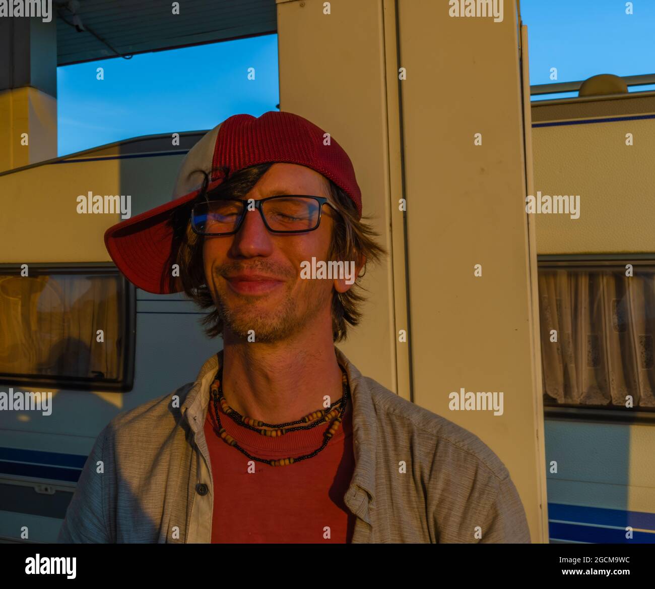 Man on petrol station in evening sunset color time Stock Photo - Alamy