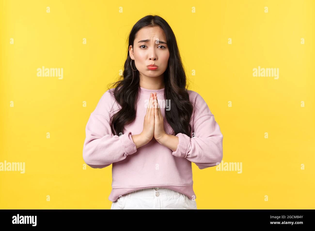 Lifestyle, emotions and advertisement concept. Pitiful cute asian girl ...