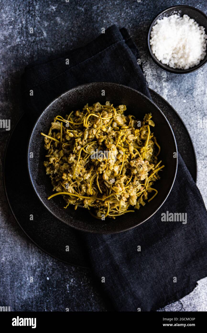 Bowl of traditional Georgian pickled jonjoli appetiser with salt Stock ...