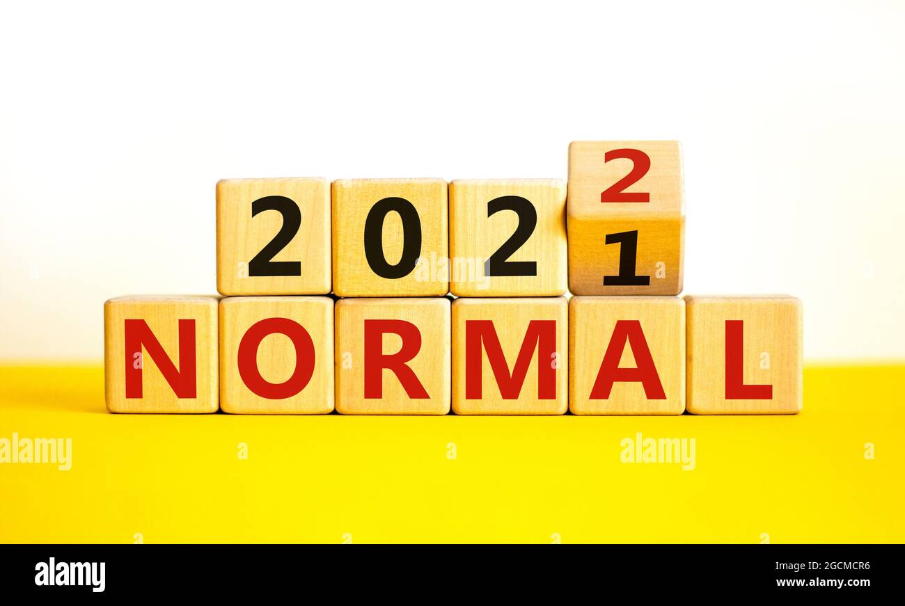 Symbol of covid-19 normal in 2022. Turned a wooden cube and changed ...