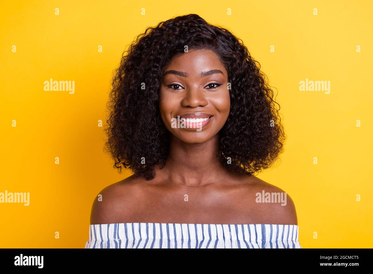 Photo of charming shiny dark skin woman wear striped outfit smiling ...