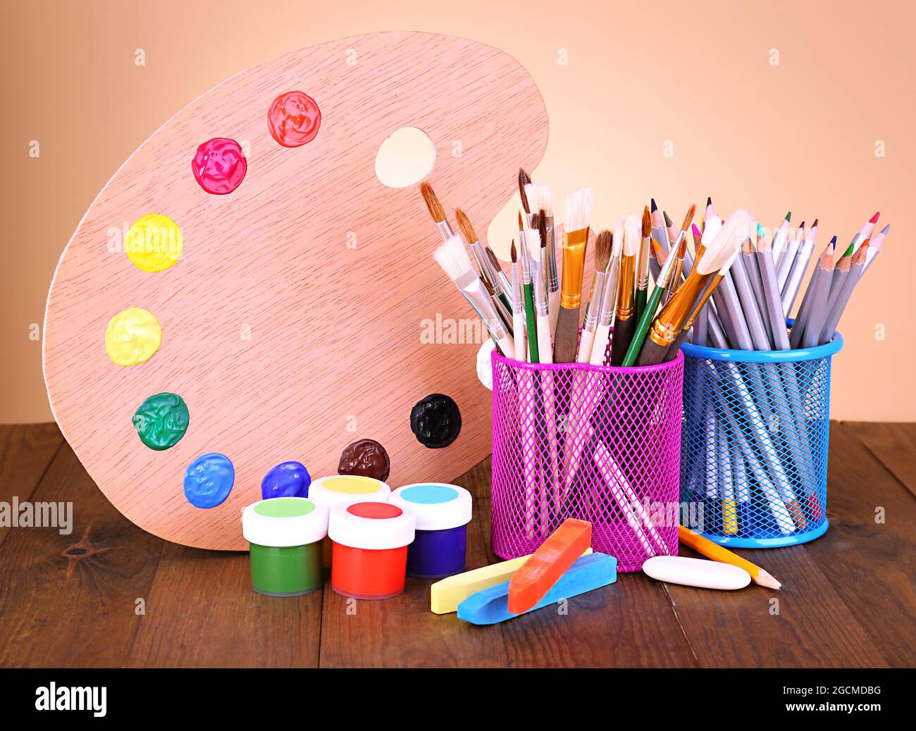 Composition of various creative tools on table on beige background ...