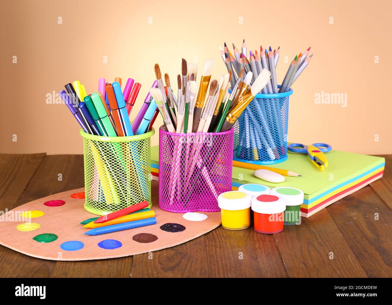 Composition of various creative tools on table on beige background ...