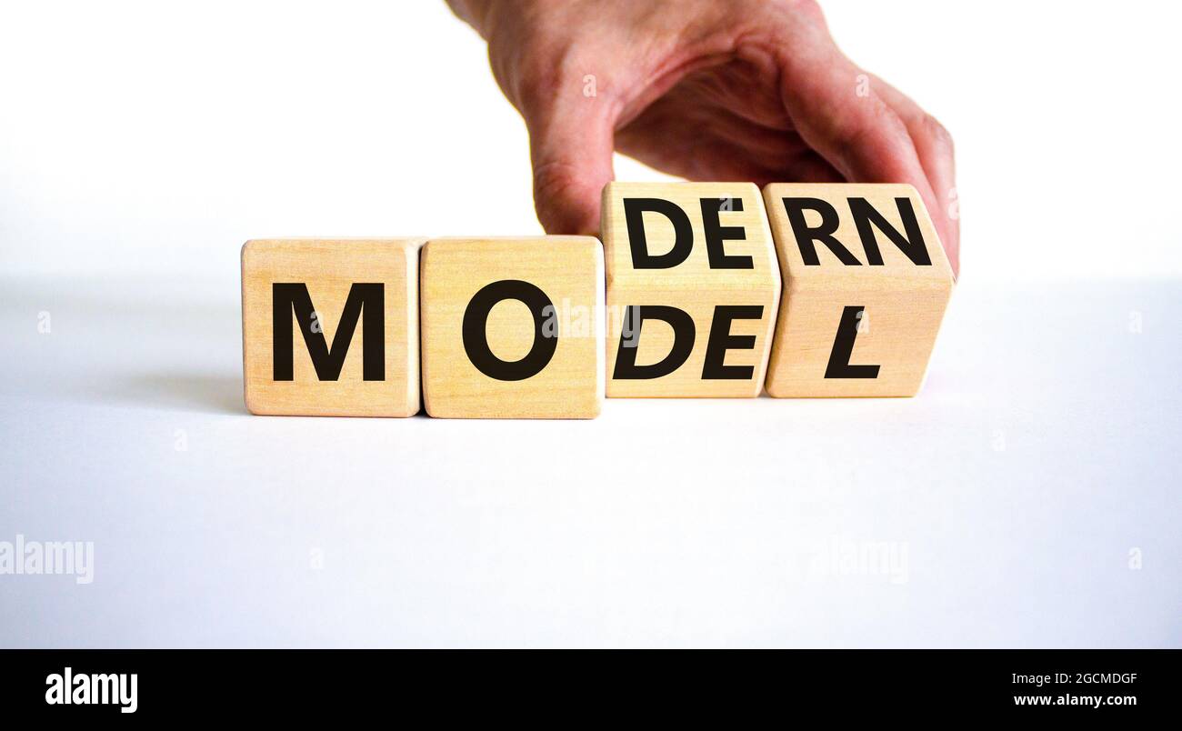 Modern model symbol. Businessman turns wooden cubes and changes the ...