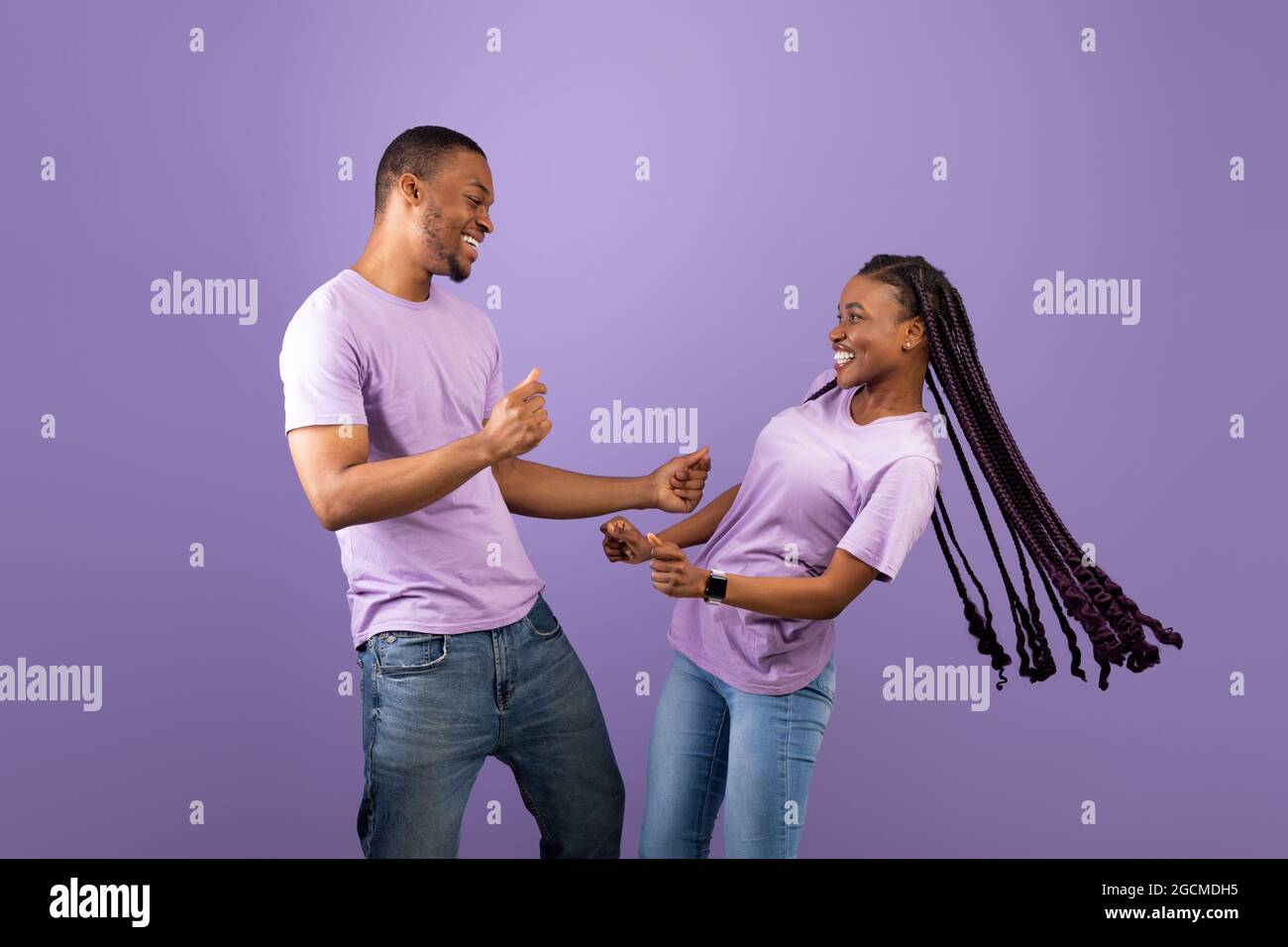 Portrait of emotional black couple dancing at studio Stock Photo - Alamy