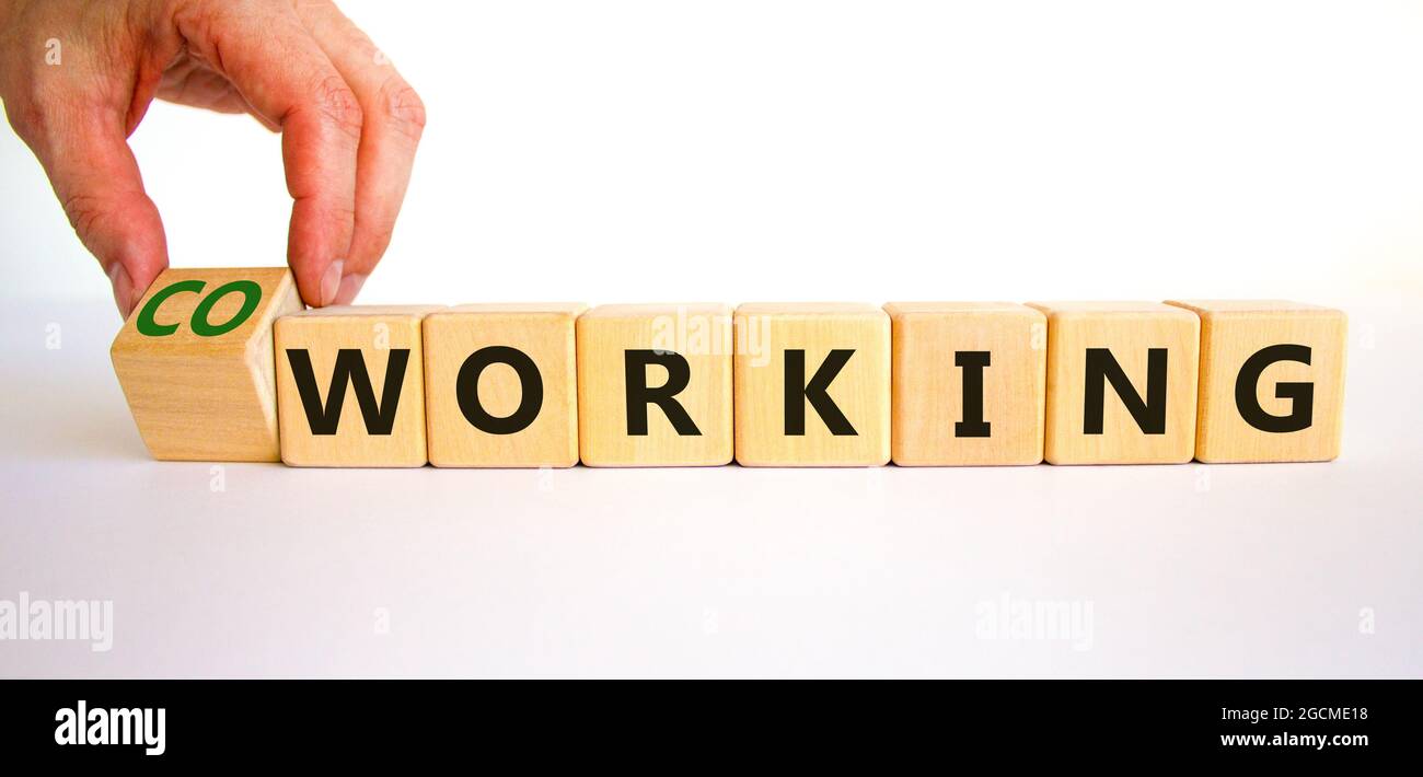 Working or coworking symbol. Businessman turns a cube and changes the ...