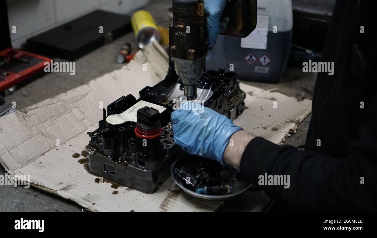 automatic transmison repair at the mechanics Stock Photo - Alamy