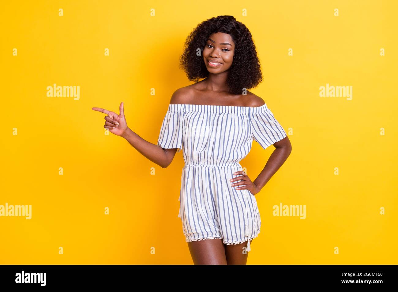 Portrait of attractive cheerful girl demonstrating solution copy empty ...