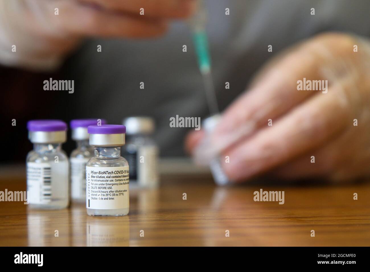 London, UK. 02nd Aug, 2021. Vials containing Pfizer-BioNTech Covid-19 ...
