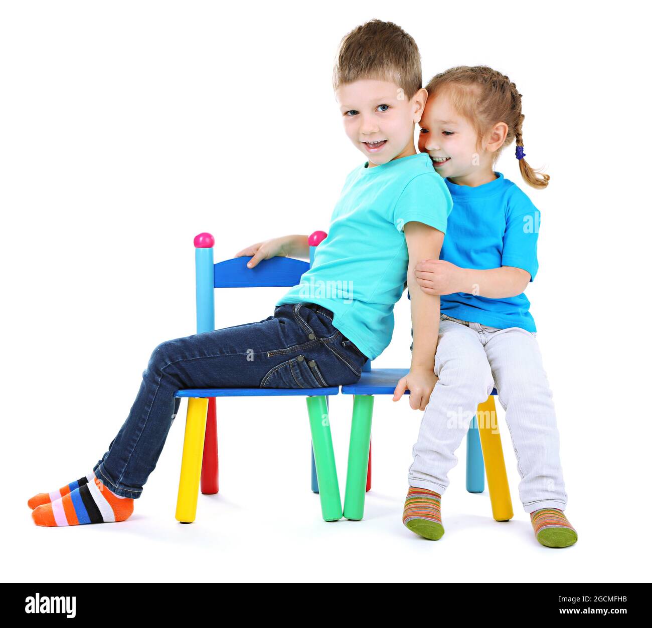 Little children playing on chairs isolated on white Stock Photo - Alamy