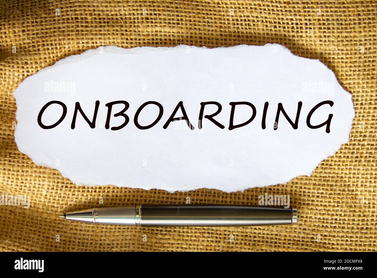 Onboarding success symbol. The word 'Onboarding' on white paper. Black ...