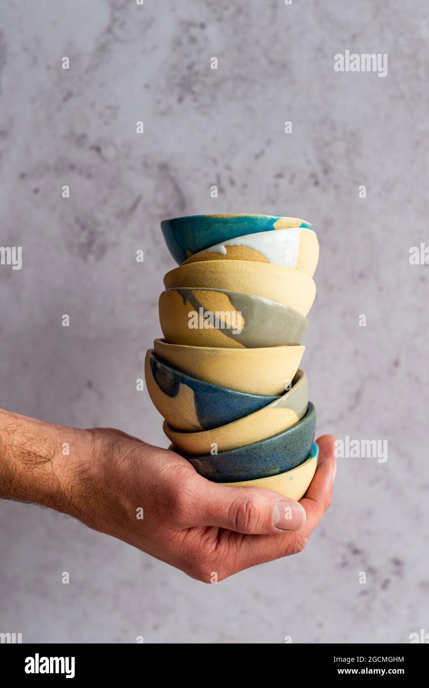 A stack of glazed ceramic bowls Stock Photo - Alamy
