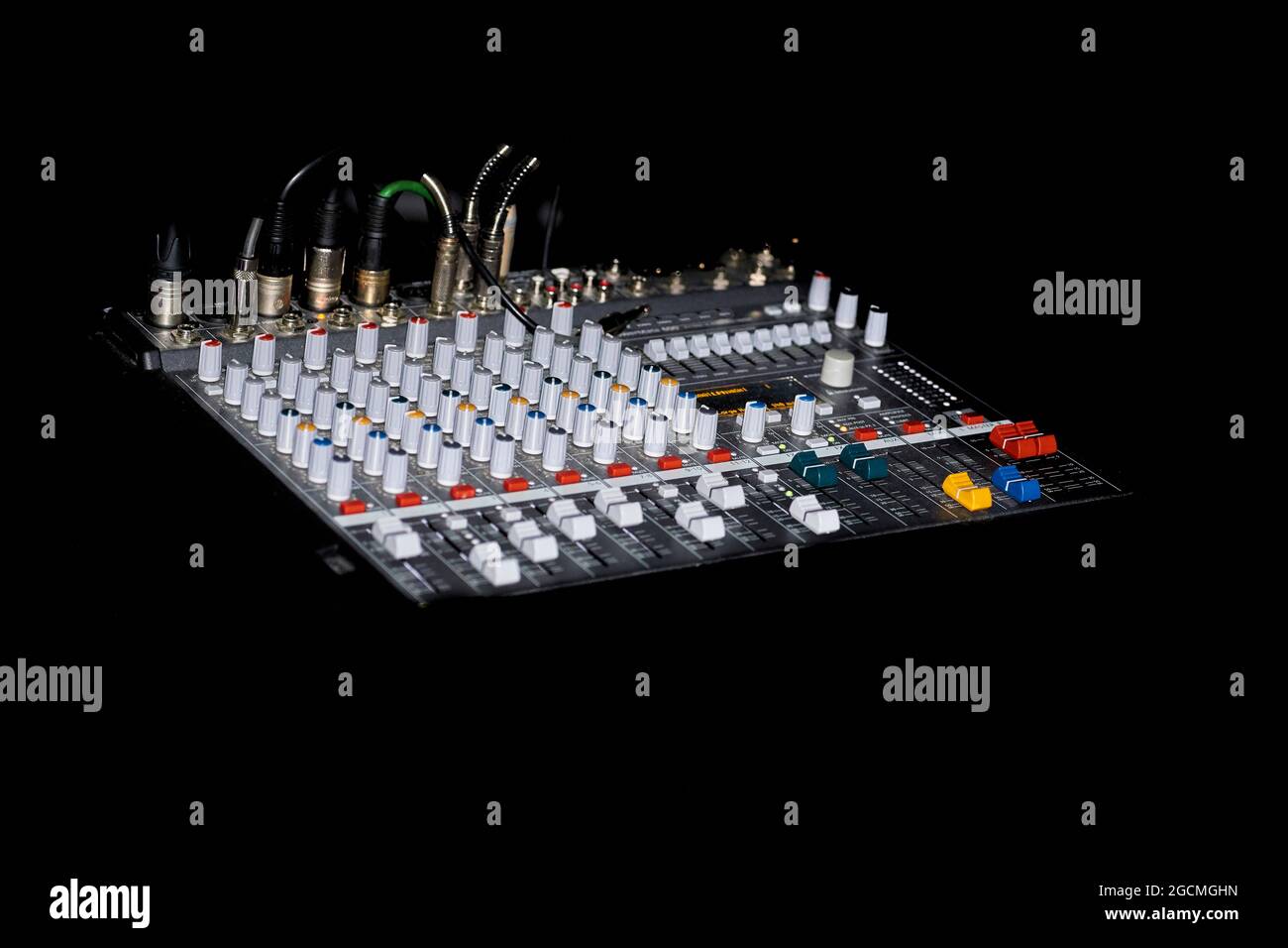 Connected music mixing console on black background Stock Photo - Alamy