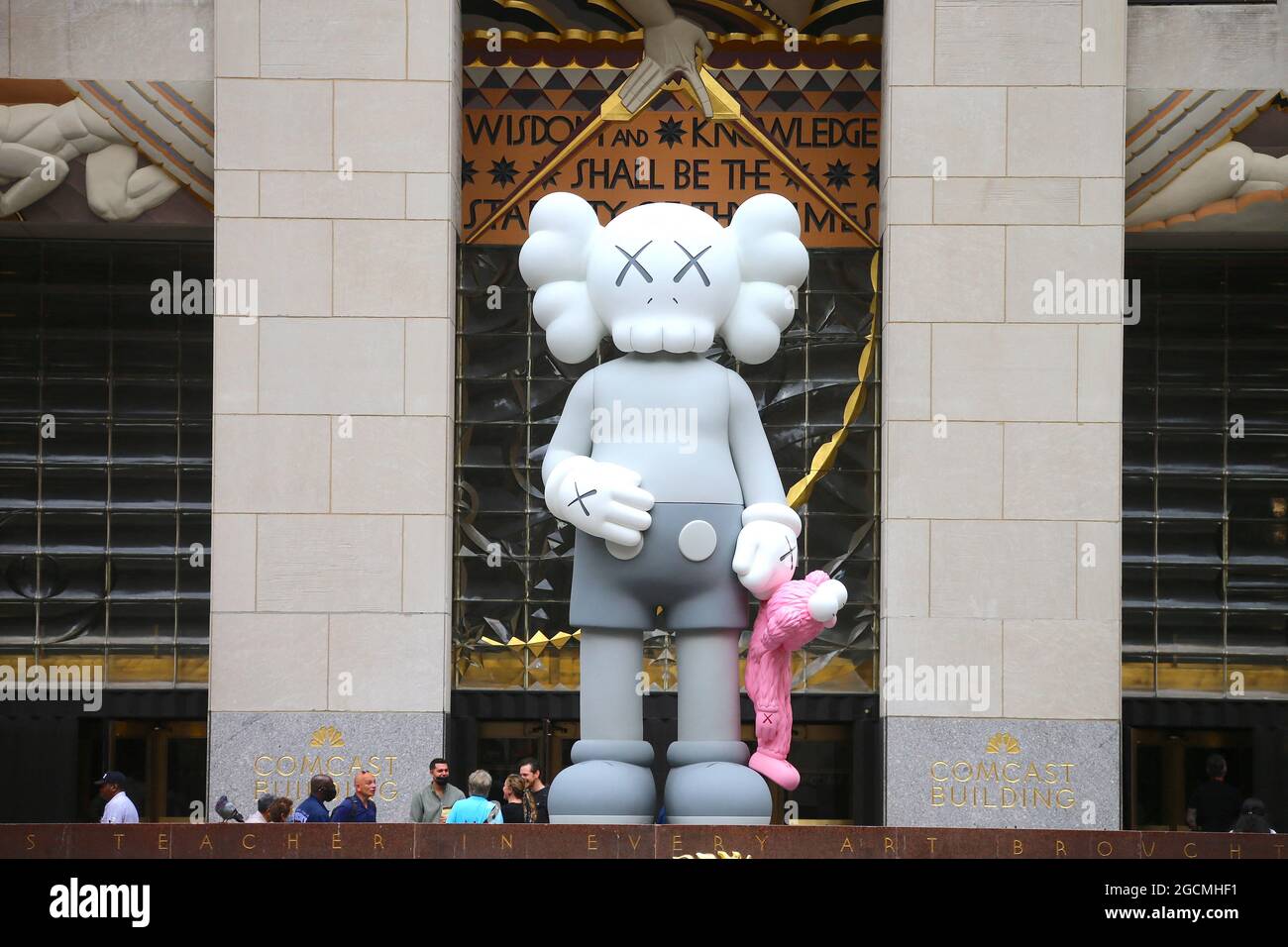 Kaws Statue by artist Brian Donnelly at The Rockefeller Center Plaza in ...