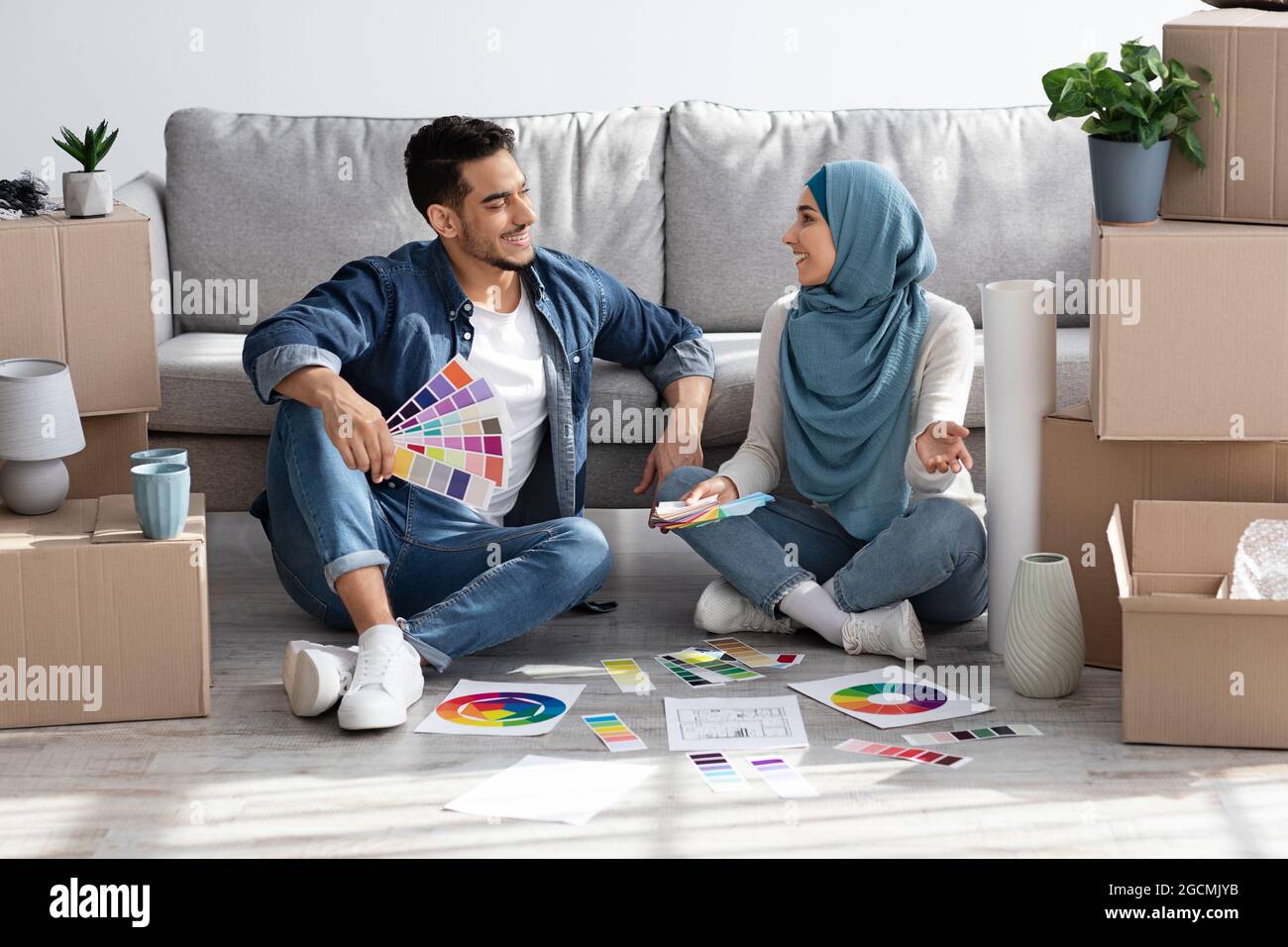 Creative arab family working on interior for their new house Stock ...